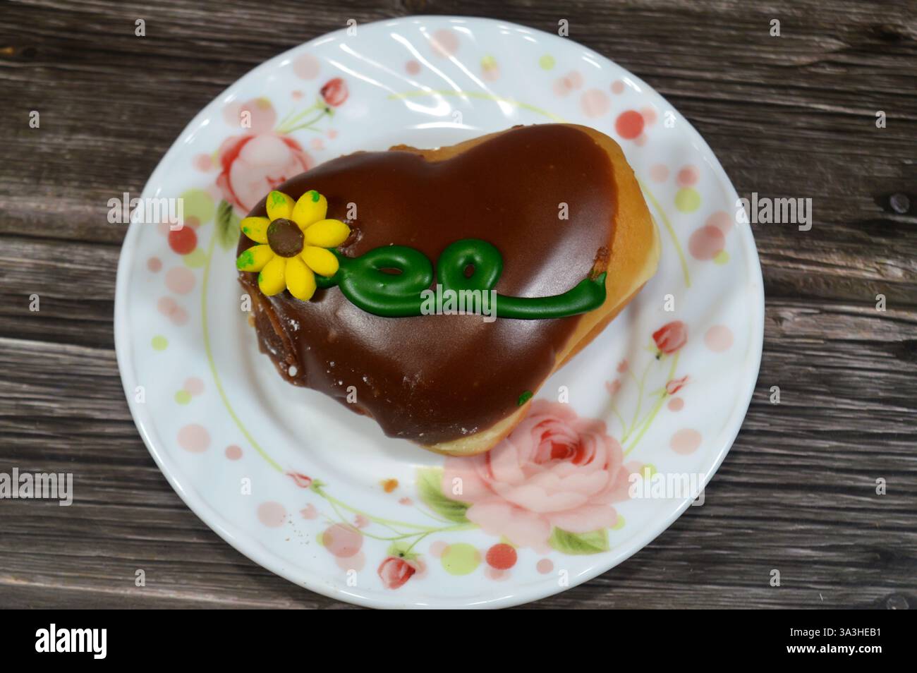 decorated heart shaped chocolate donut, a glazed, yeast raised ...