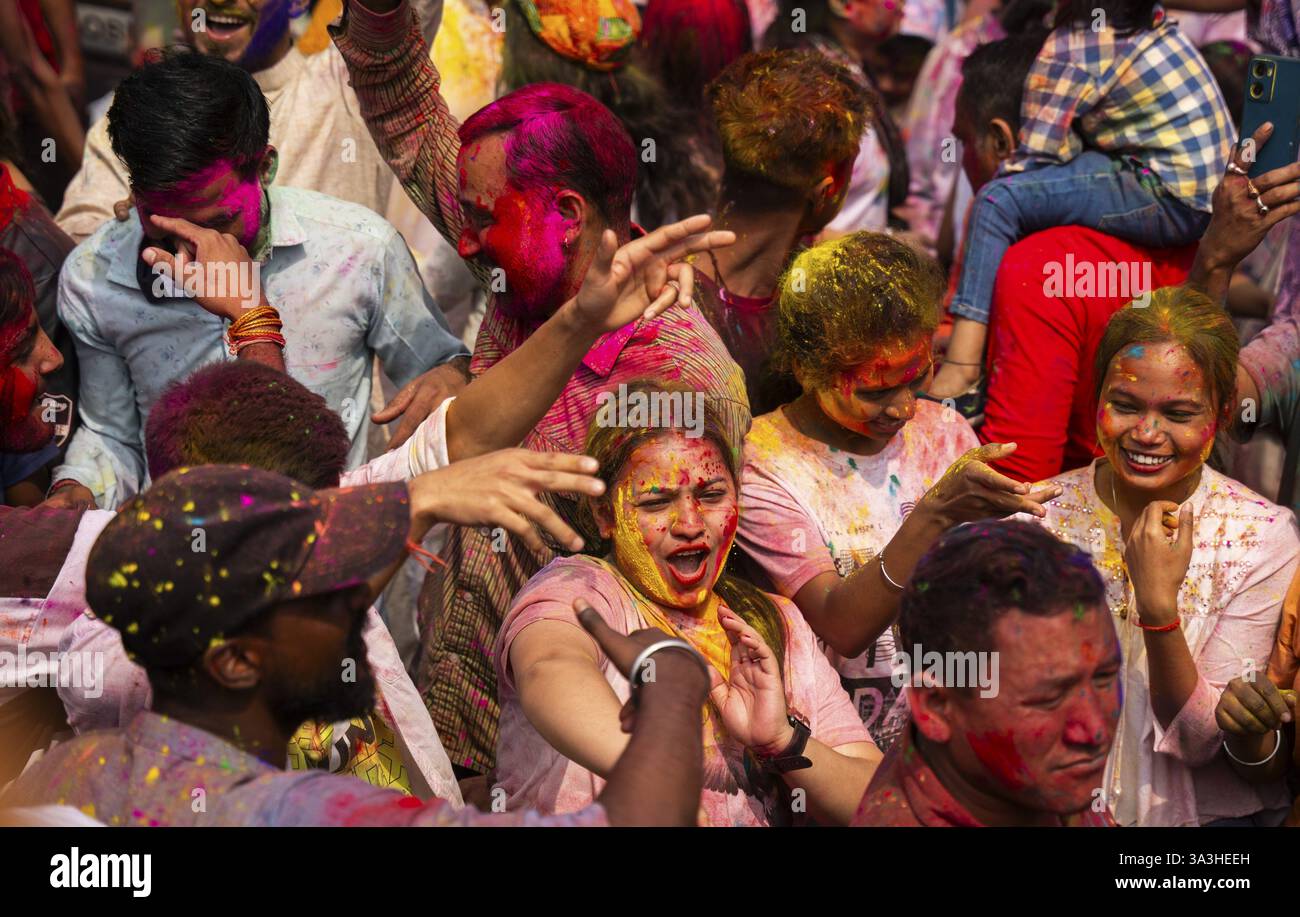 Revellers smear with Gulal or coloured powder and dance to play Holi ...
