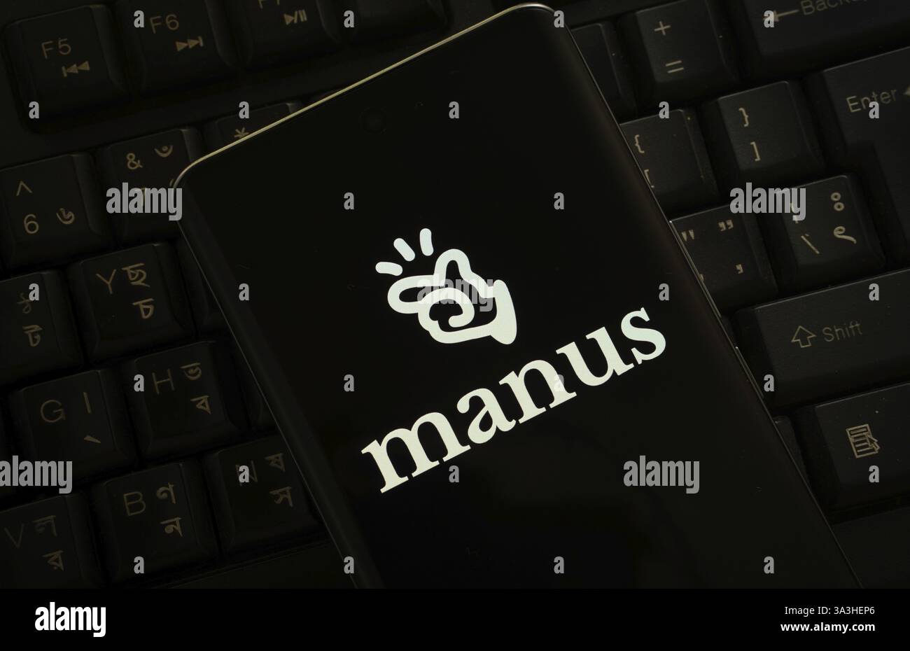 Manus Ai logo is seen on a smartphone Stock Photo - Alamy