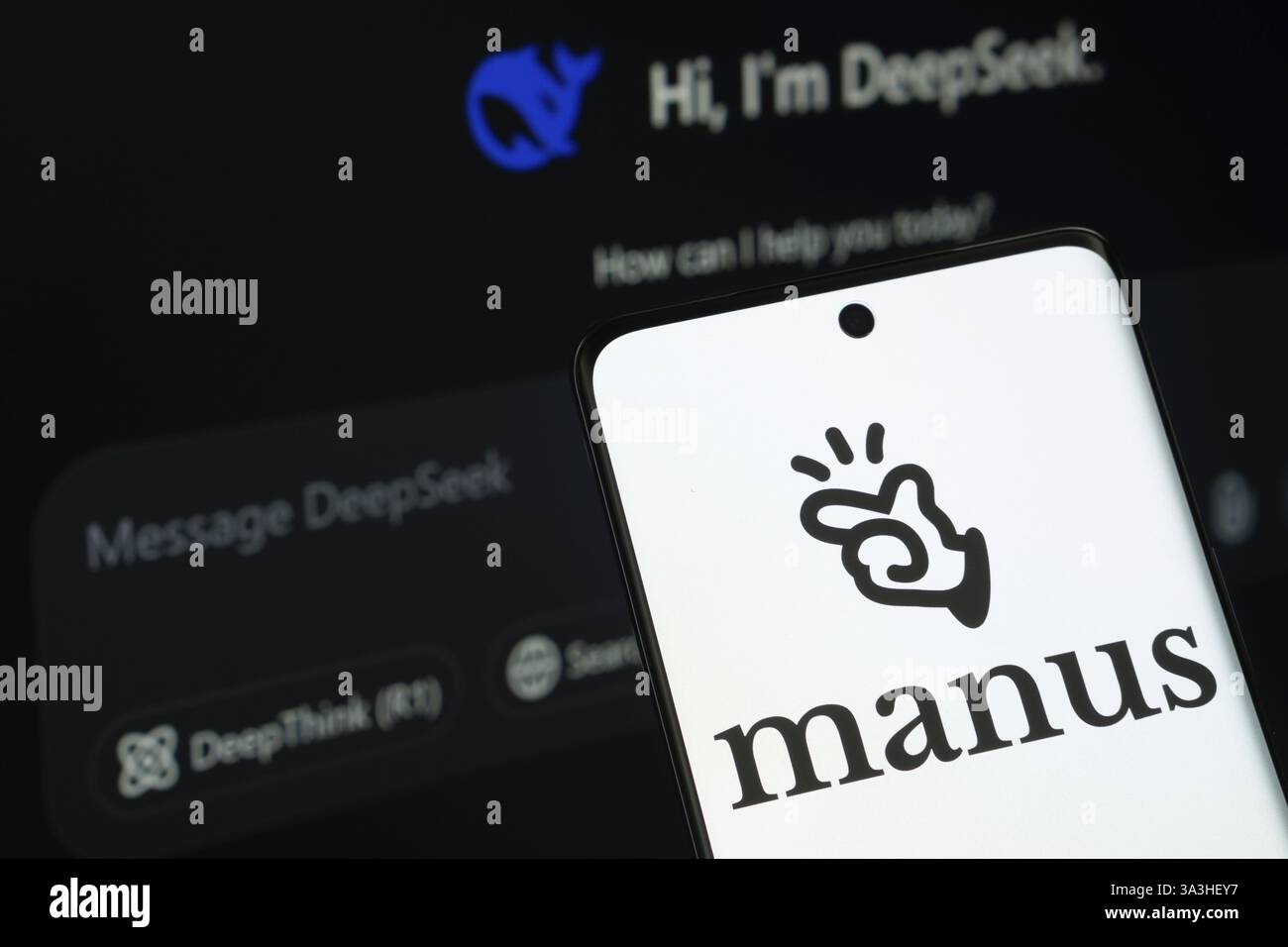 Manus Ai logo is seen on a smartphone, with the DeepSeek website ...