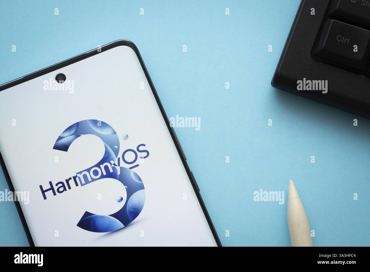 The logo of the HarmonyOS 3 is displayed on a smartphone screen Stock Photo - Alamy