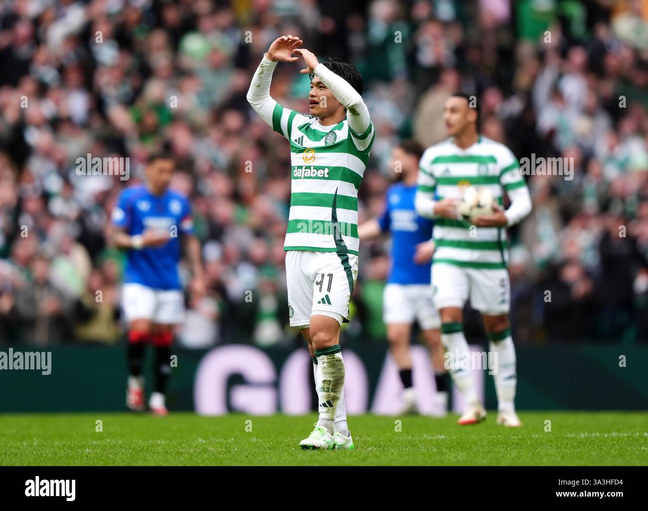 Celtic's Reo Hatate celebrates scoring their side's second goal of the ...