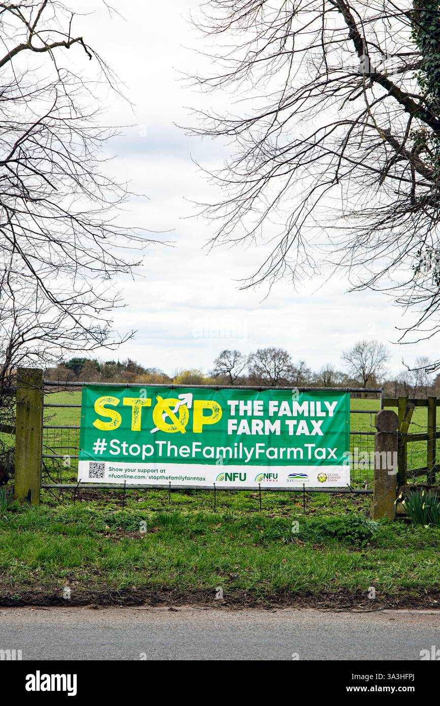 Stop the family farm tax protest banner on gate Stock Photo - Alamy