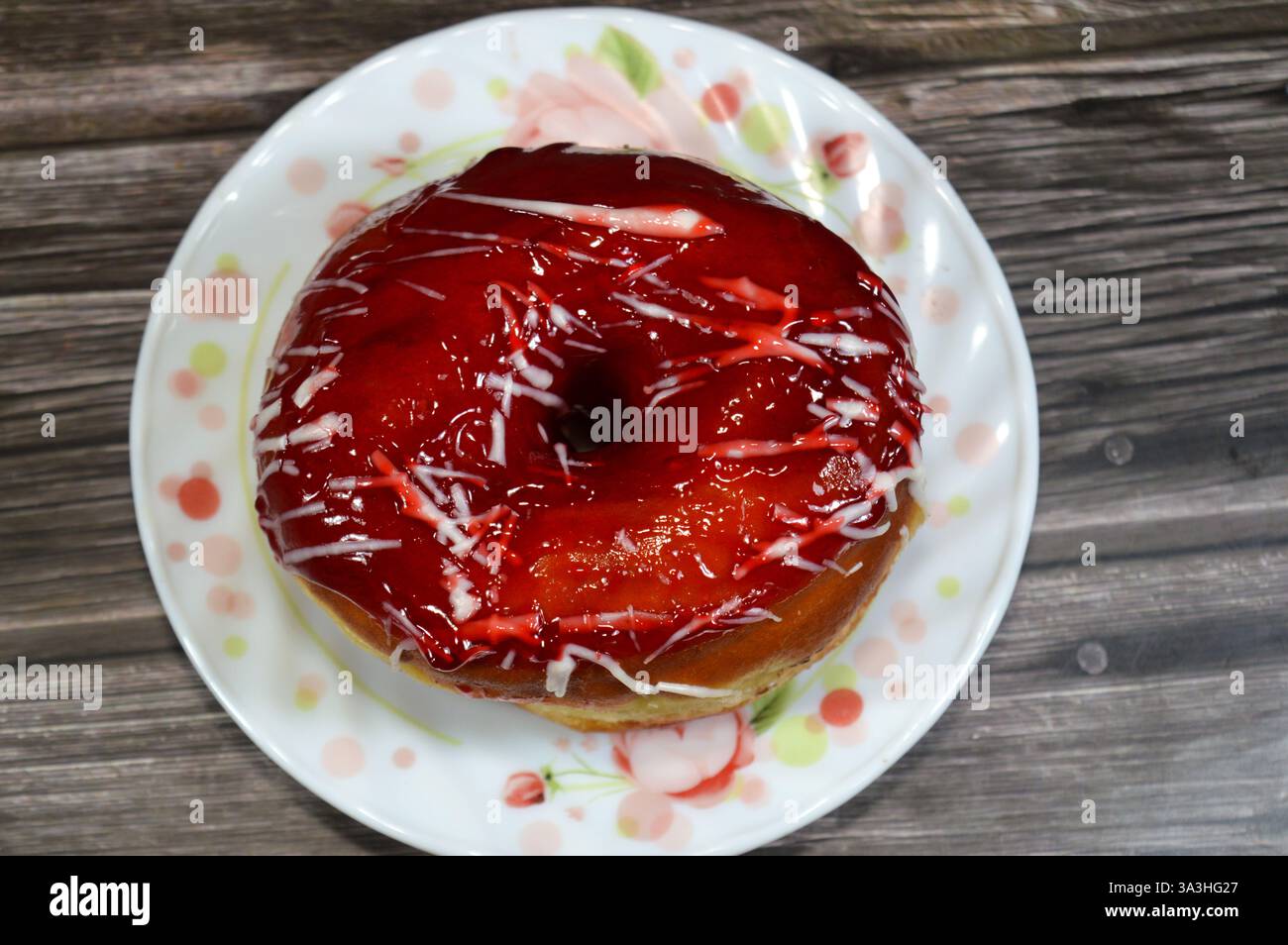 Strawberry flavor ring donut with white chocolate sauce, glazed, yeast ...