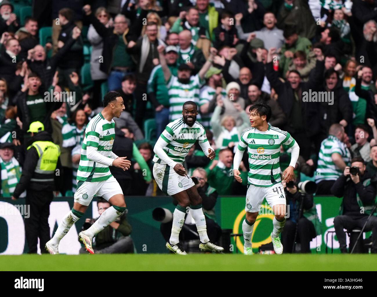 Celtic's Reo Hatate celebrates scoring their side's second goal of the ...