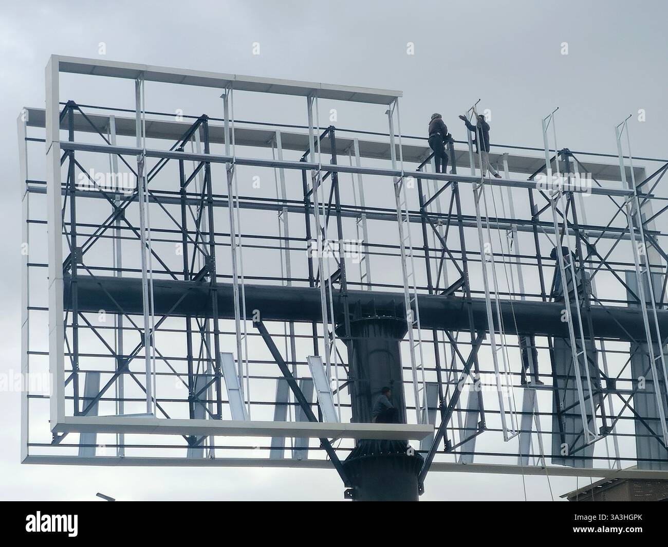 Cairo, Egypt, February 7 2025: installation of a metal sign board with ...