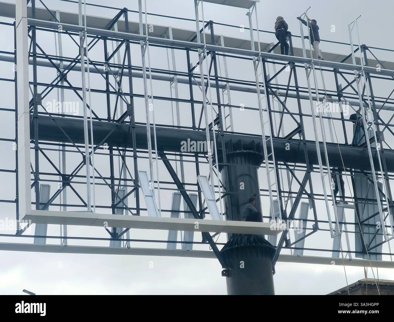 Cairo, Egypt, February 7 2025: installation of a metal sign board with ...