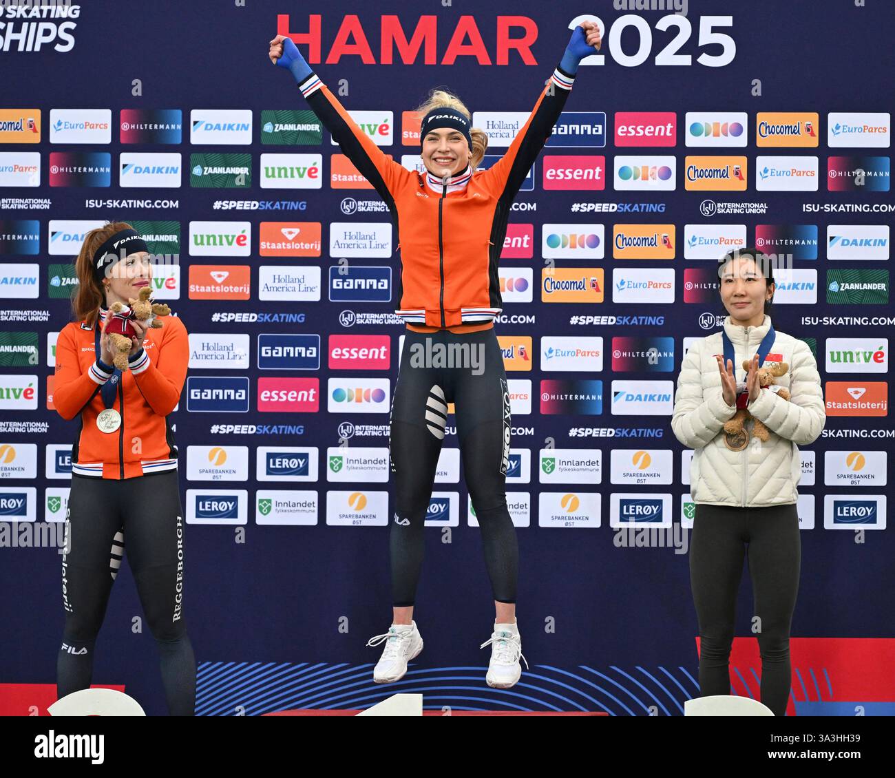 Netherlands' Joy Beune (C) jumps at the awards ceremony of the women's ...