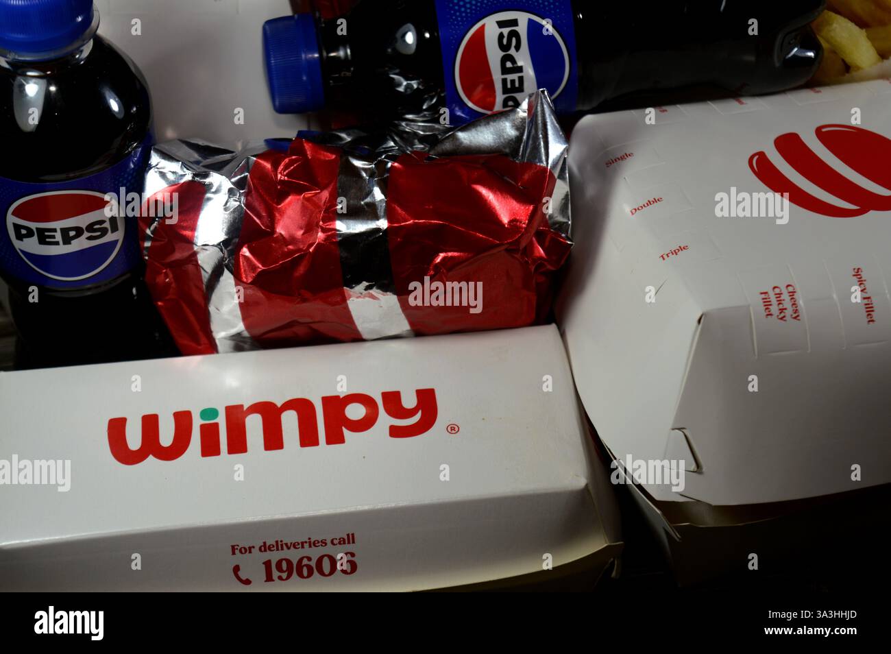 Cairo, Egypt, February 13 2025: Pepsi bottles and Wimpy delivery fast ...
