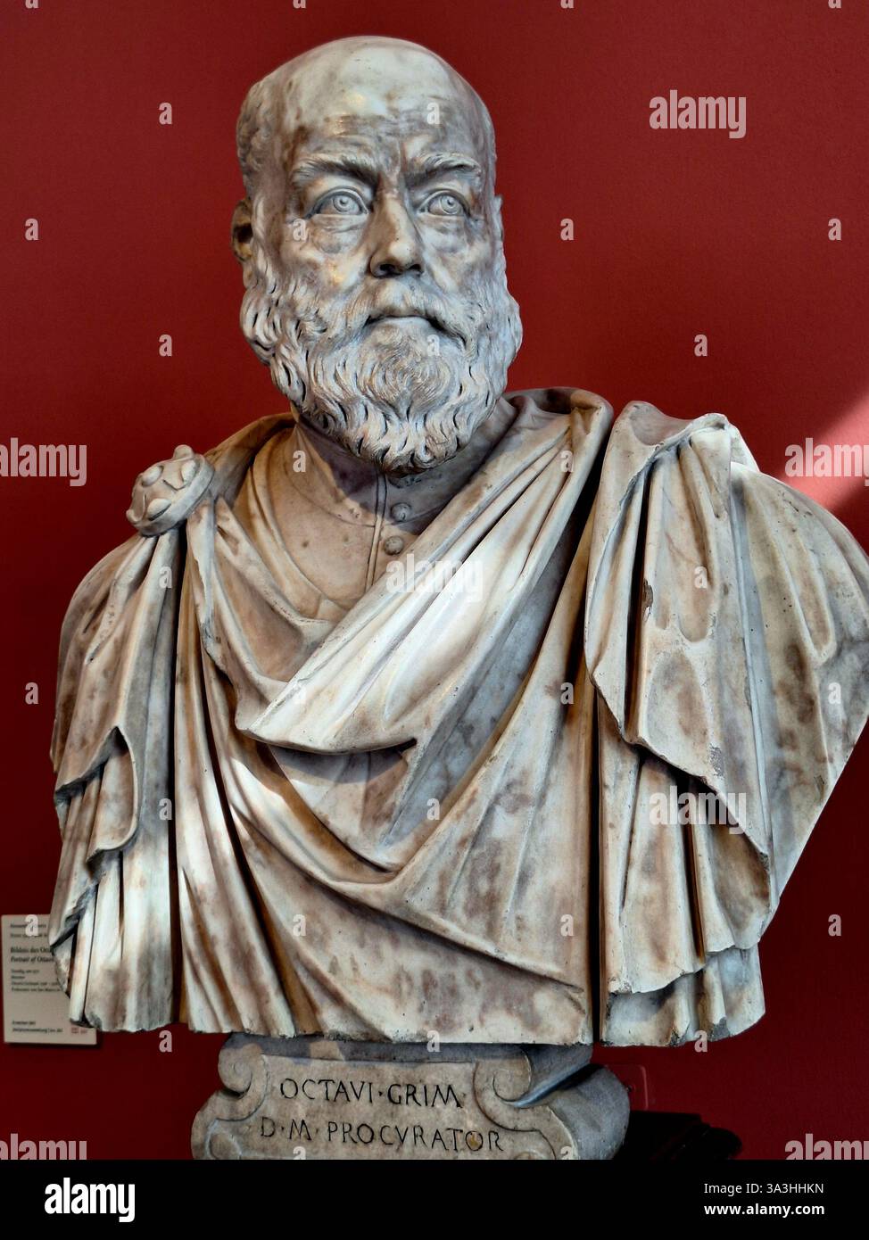 Vertical close up portrait of an ancient marble bust or statue of a ...
