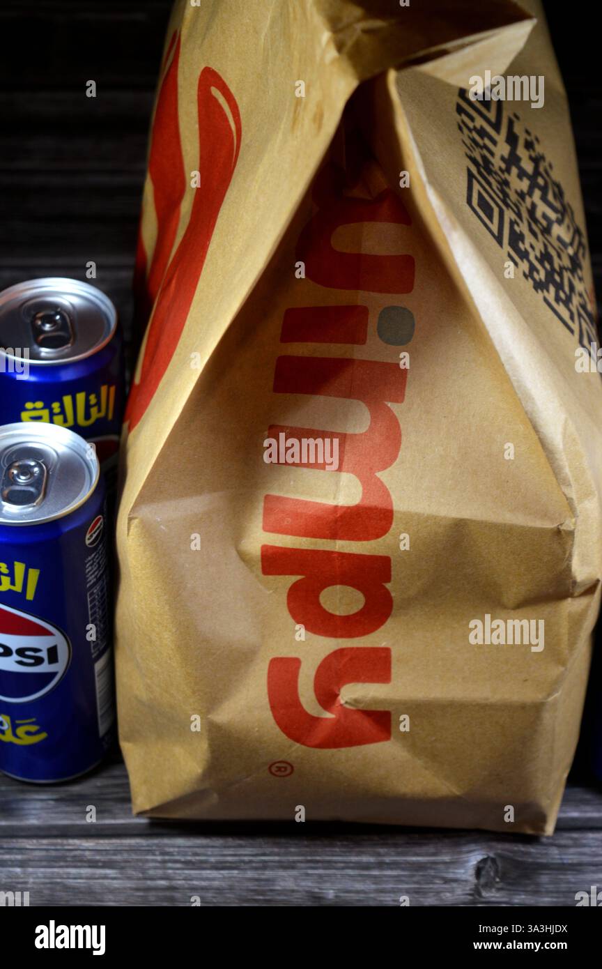 Cairo, Egypt, February 8 2025: Pepsi cans and Wimpy delivery fast food ...