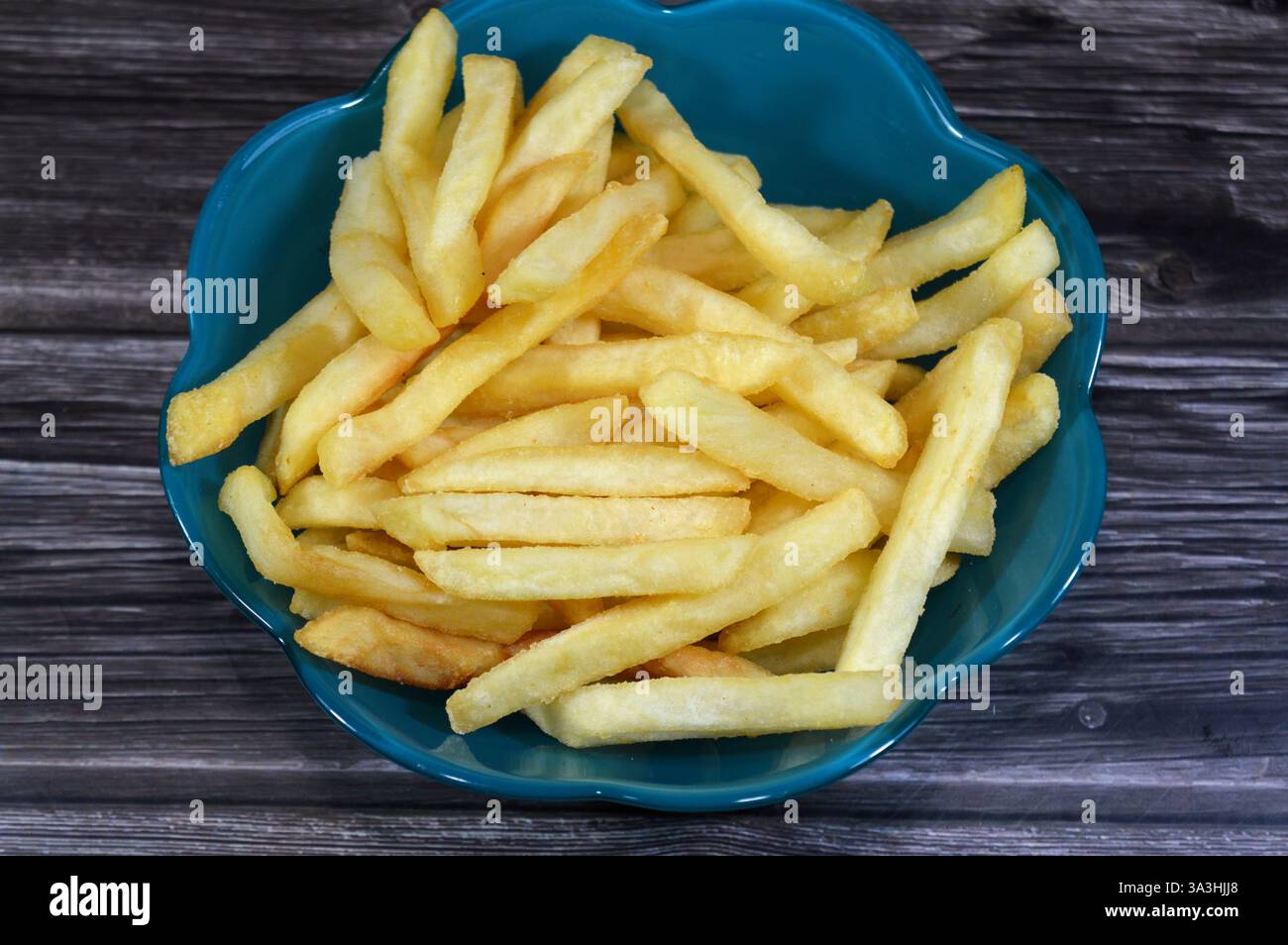 French fries, chips, prepared by cutting potatoes into even strips ...