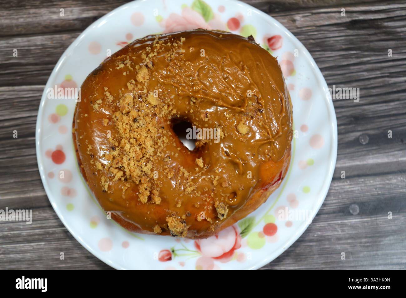 Biscuit paste cream ring donut, a glazed, yeast raised, American style ...