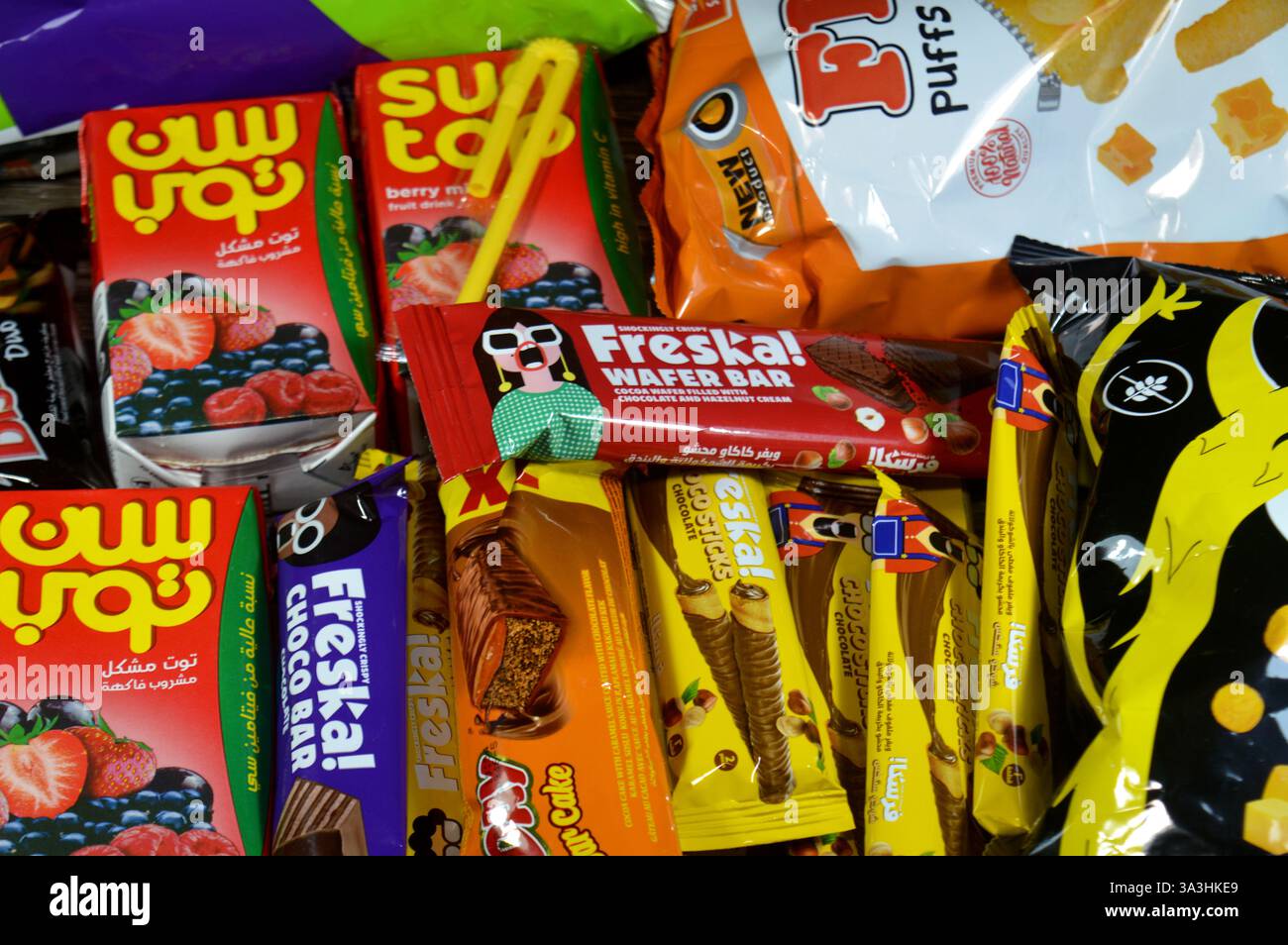 Cairo, Egypt, February 1 2025: assorted biscuits, chocolate, juice ...