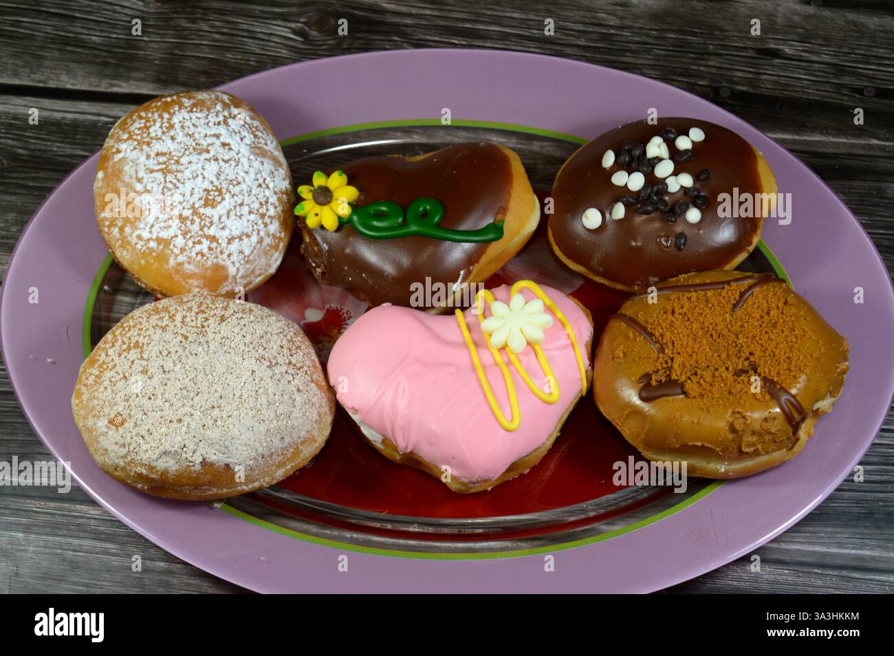 Assorted round and heart shaped donuts, glazed, yeast raised, American ...