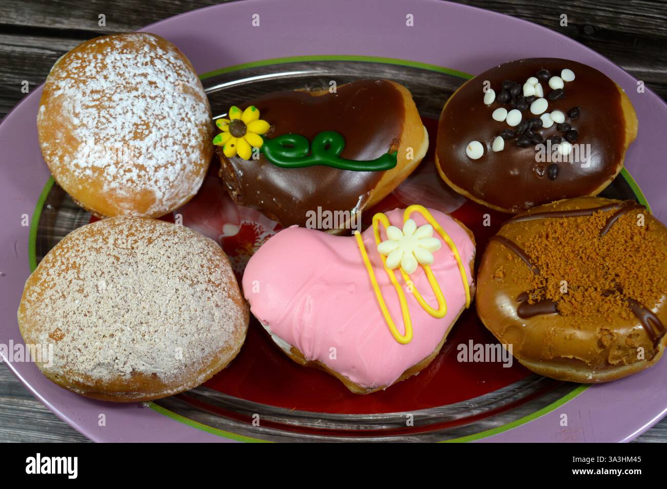Assorted round and heart shaped donuts, glazed, yeast raised, American ...