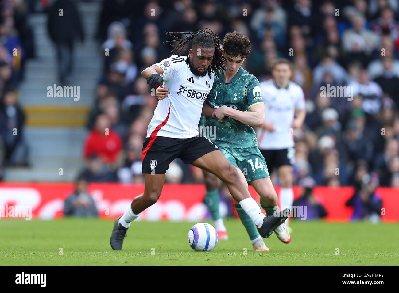 London, UK. 16th Mar, 2025. Alex Iwobi of Fulham and Archie Gray of ...