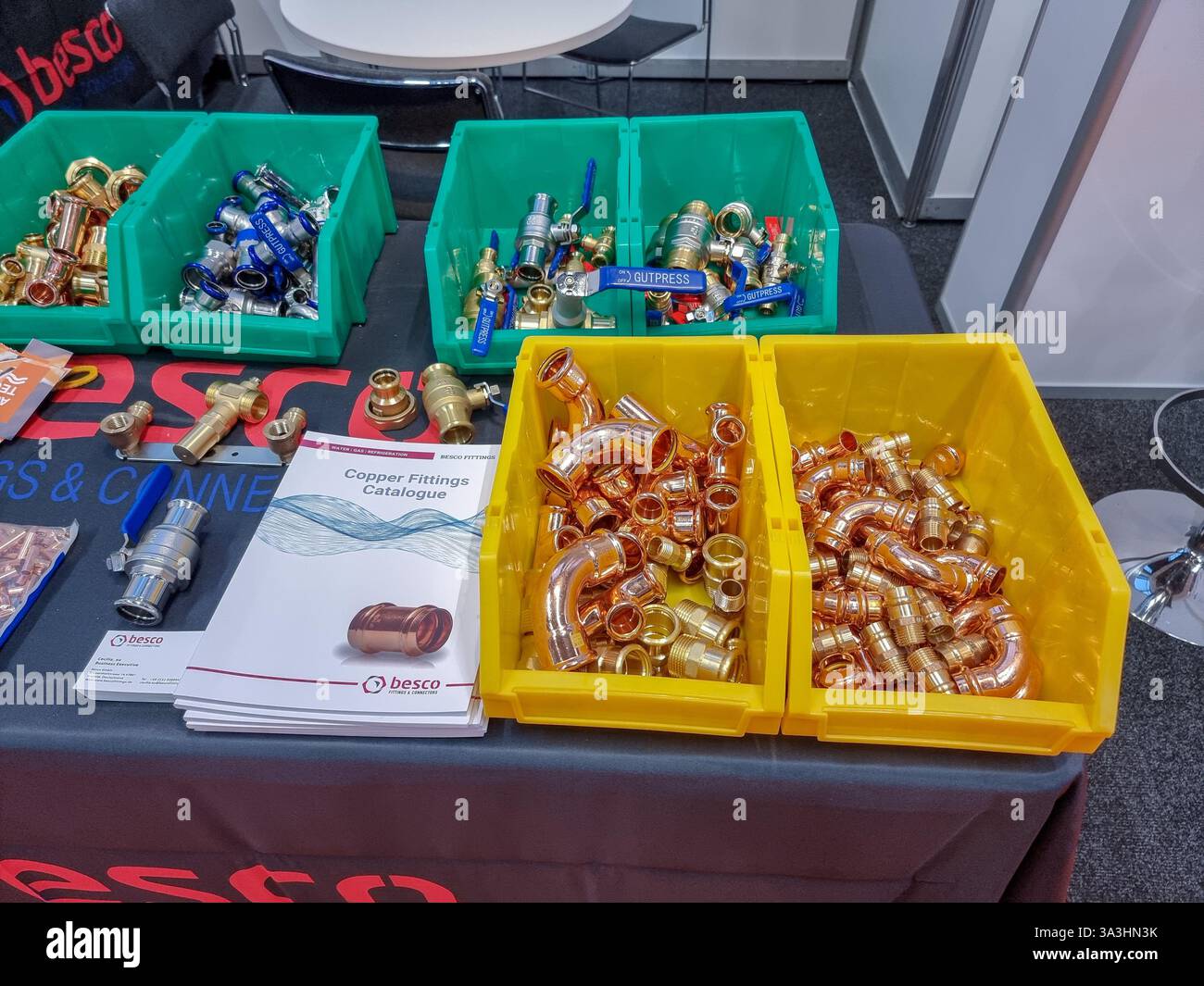 Plumbing components (fittings, valves, connectors) displayed in boxes ...