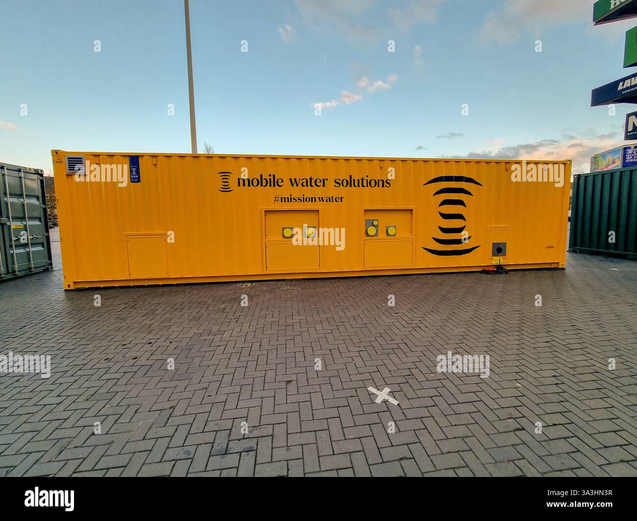 Yellow container with Mobile Water solutions from Saur at the Aquatech ...