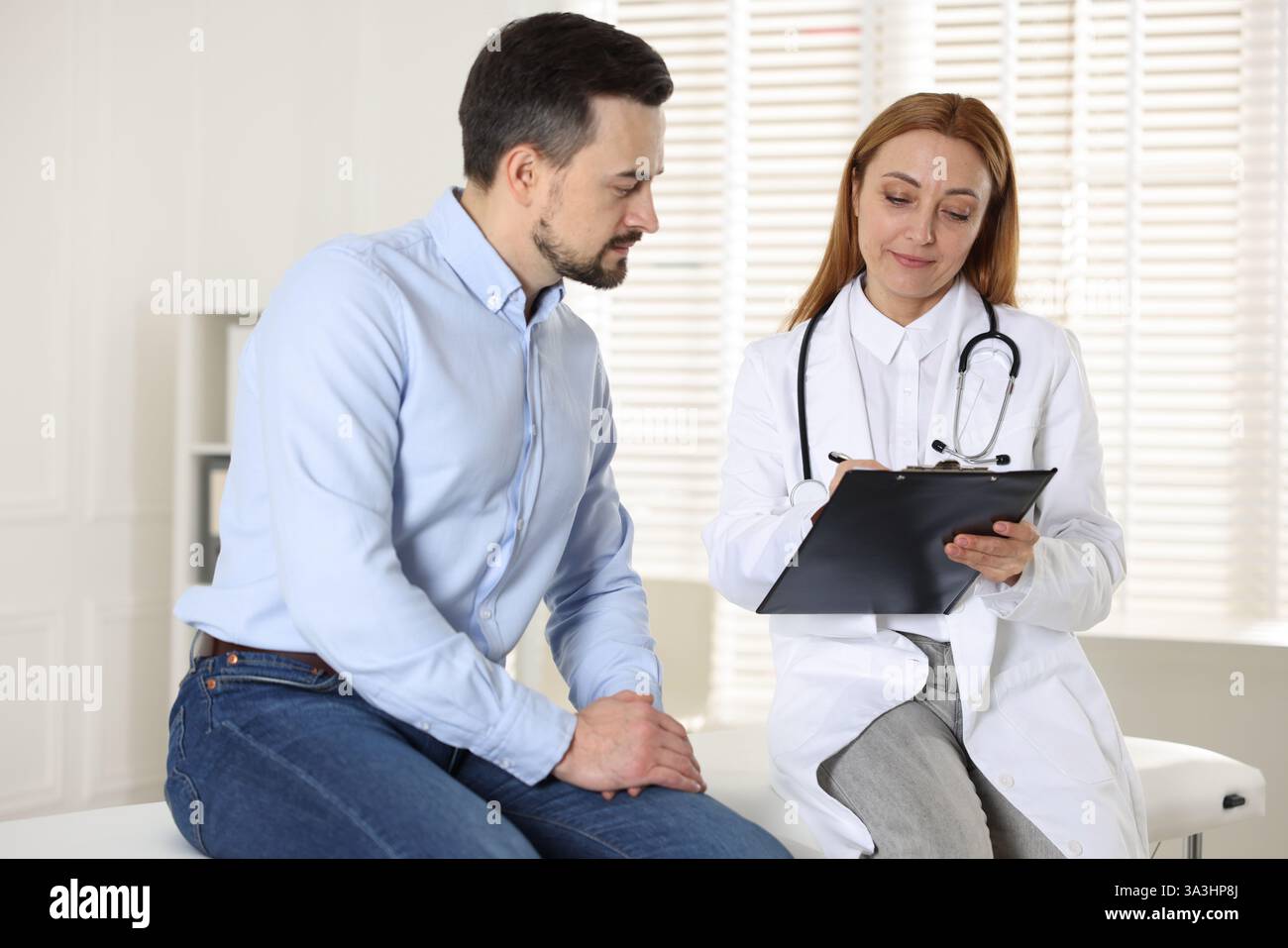 Man having appointment with cardiologist in clinic Stock Photo - Alamy