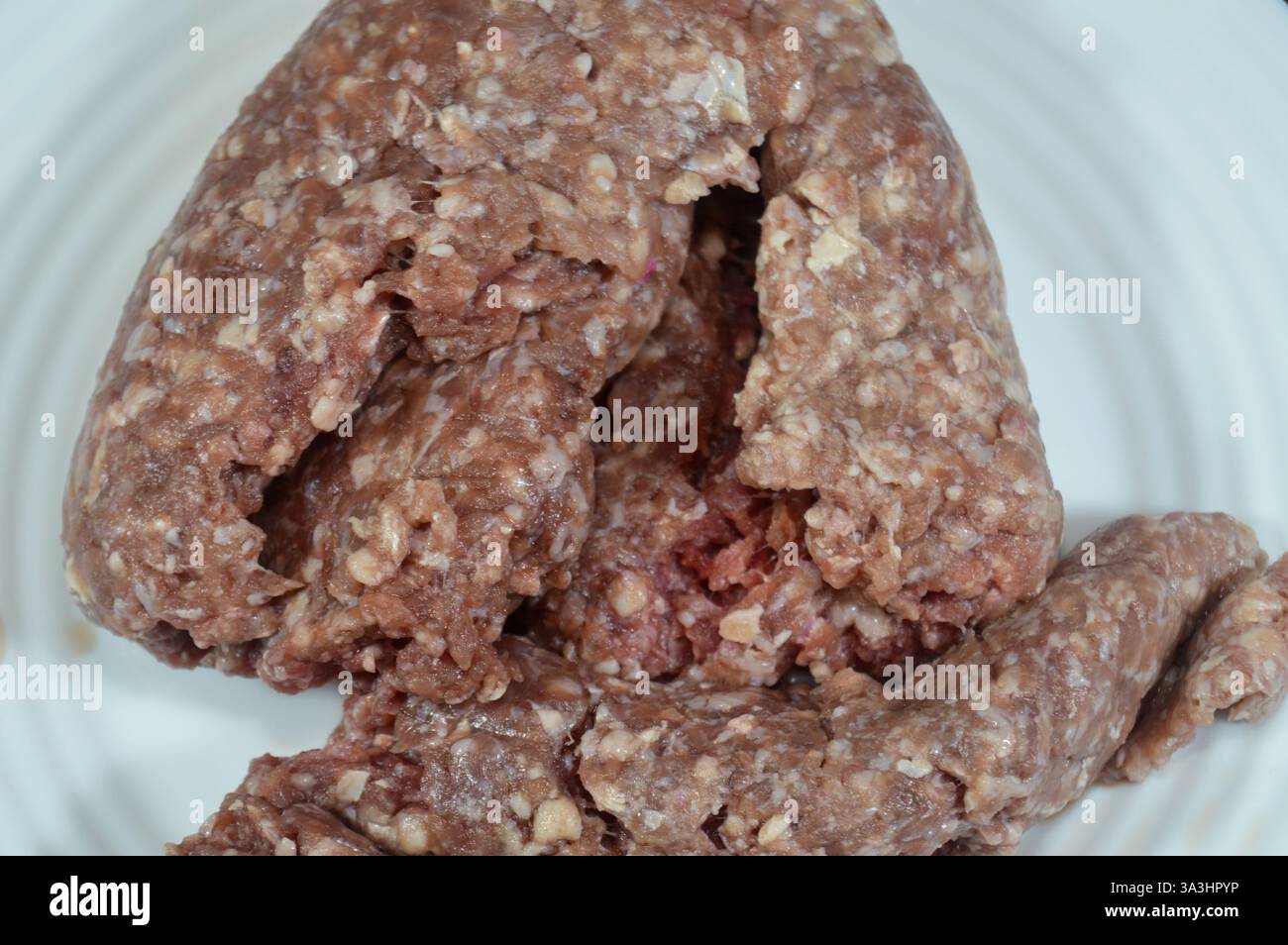 Ground mince or minced meat, meat finely chopped by a meat grinder or a ...