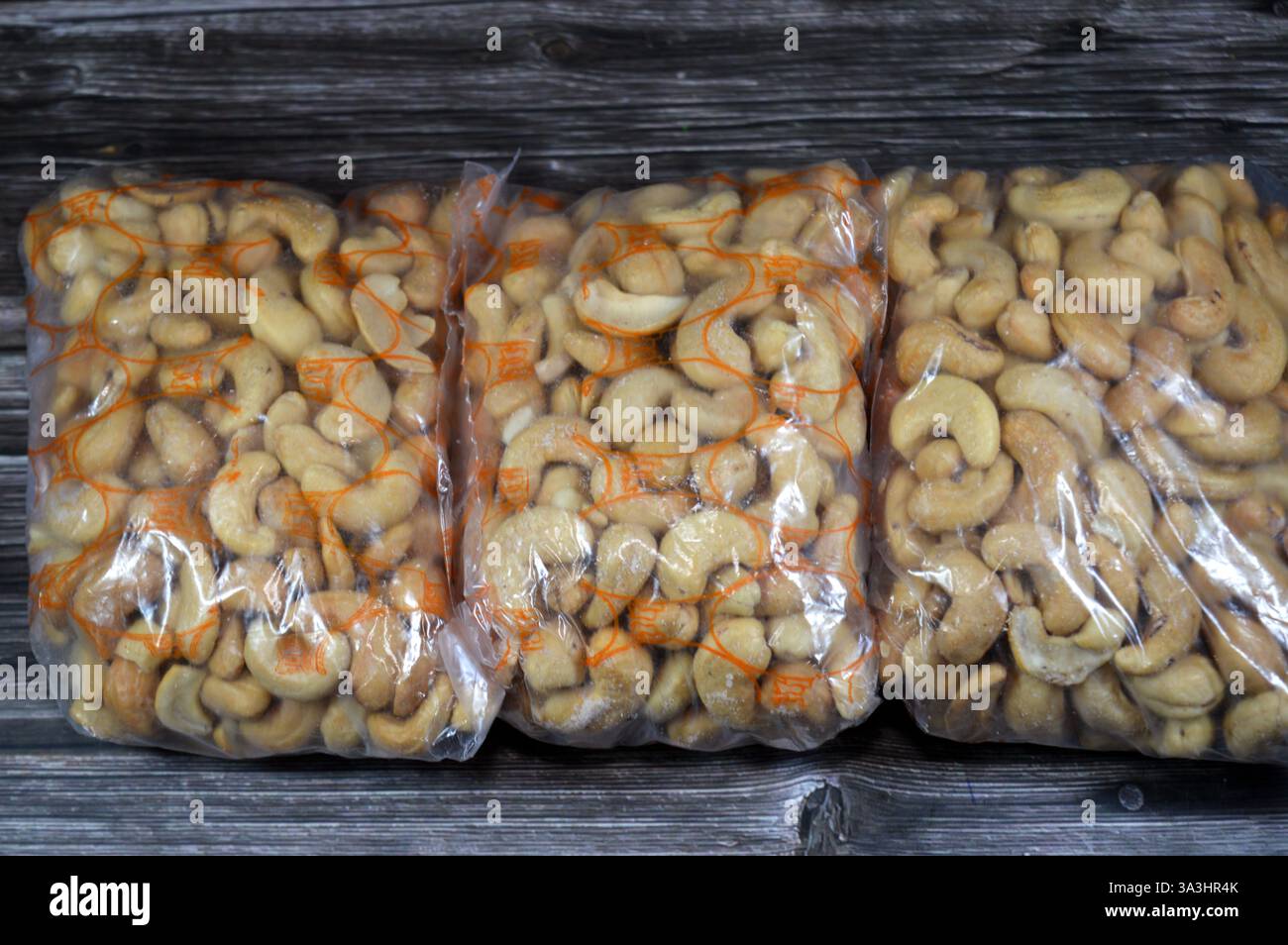 Salted and roasted Cashew nuts, Cashew is the common name of a tropical ...