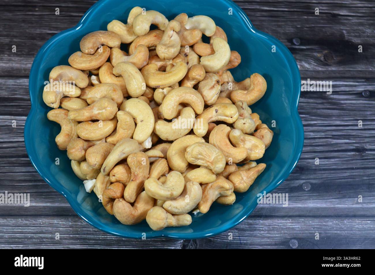 Salted and roasted Cashew nuts, Cashew is the common name of a tropical ...