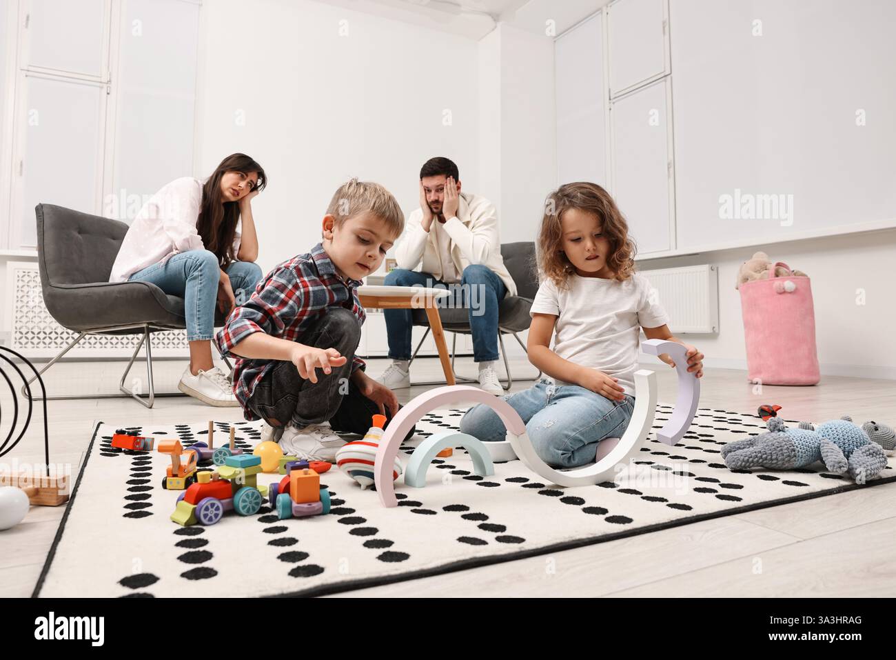 Hyperactive children playing and their overwhelmed parents at home, low ...