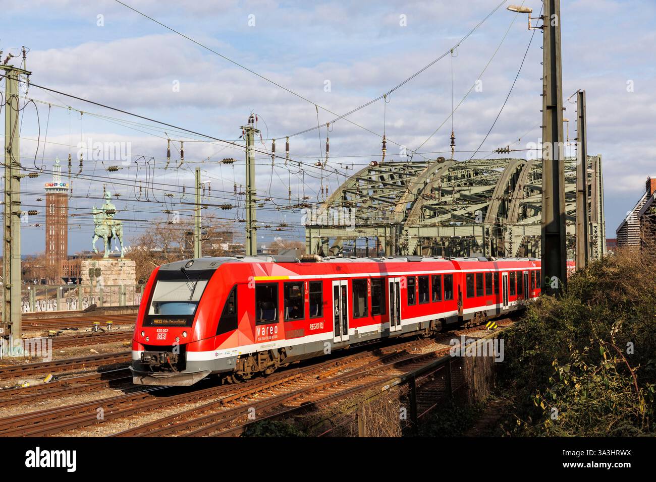 Deutsche Bahn local train in front of Hohenzollernbruecke in the ...