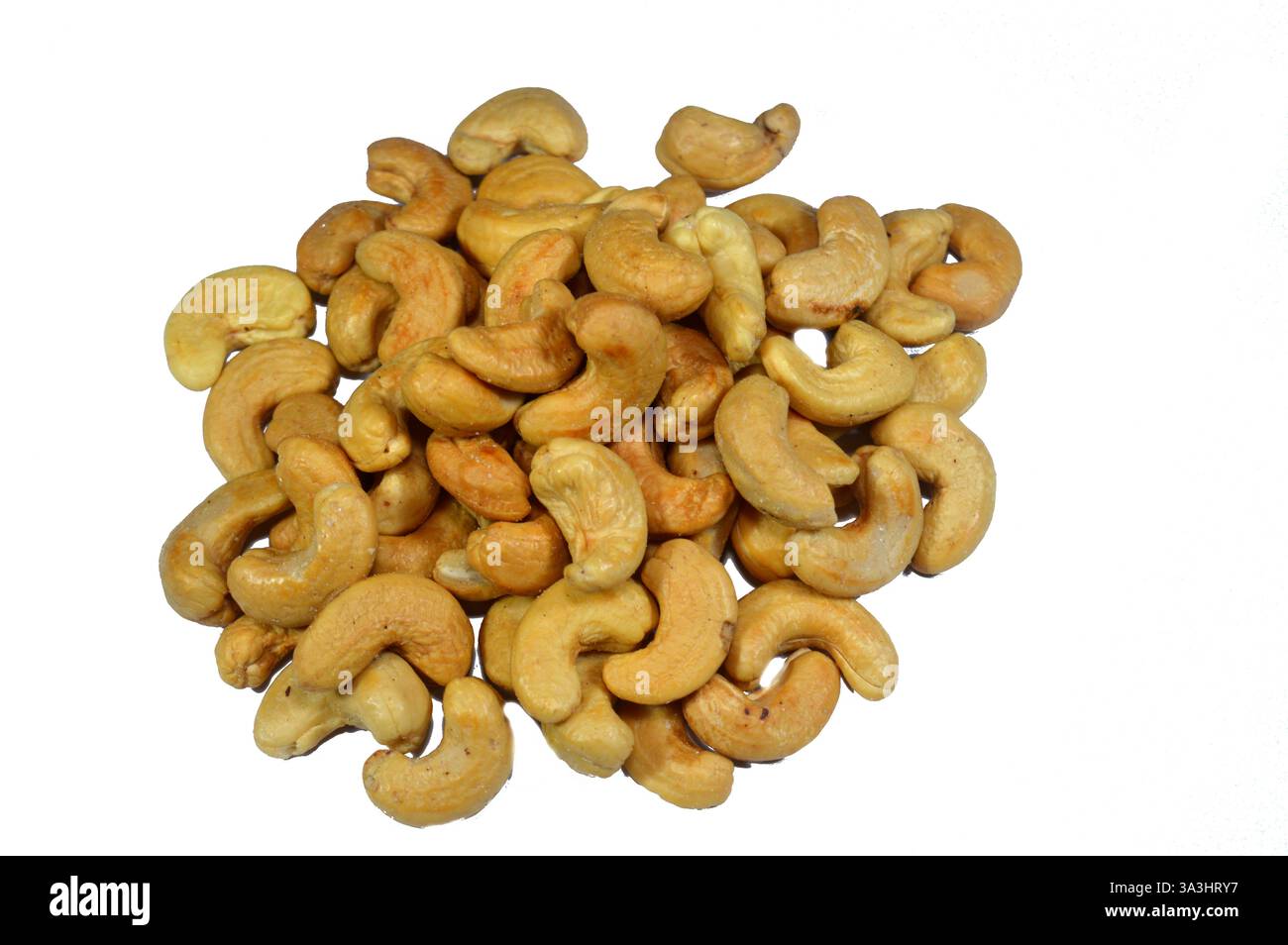 Salted and roasted Cashew nuts, Cashew is the common name of a tropical ...