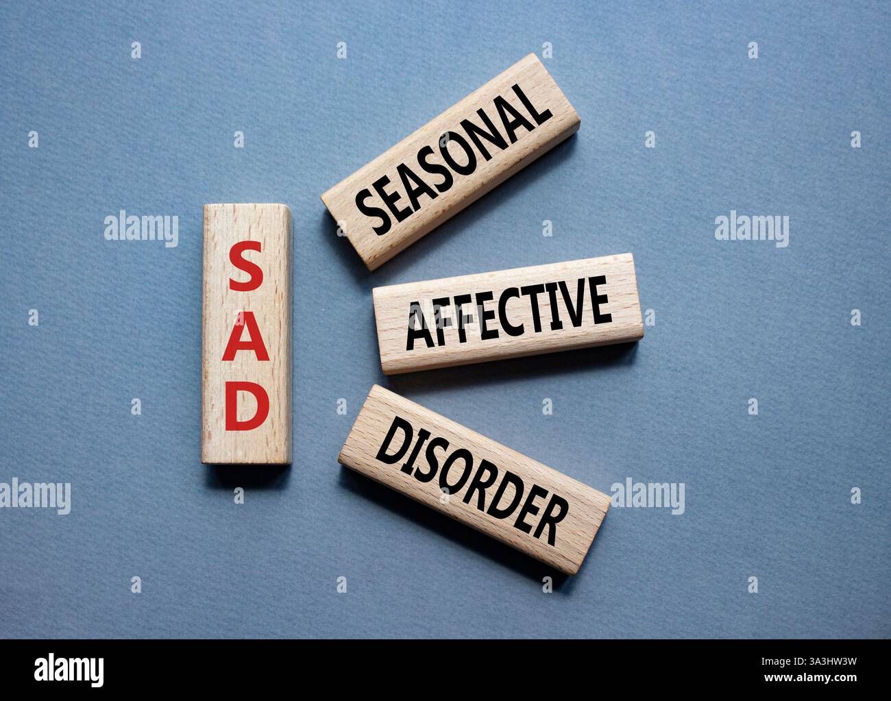 Sad - Seasonal Affective Disorder symbol. Wooden blocks with words Sad ...