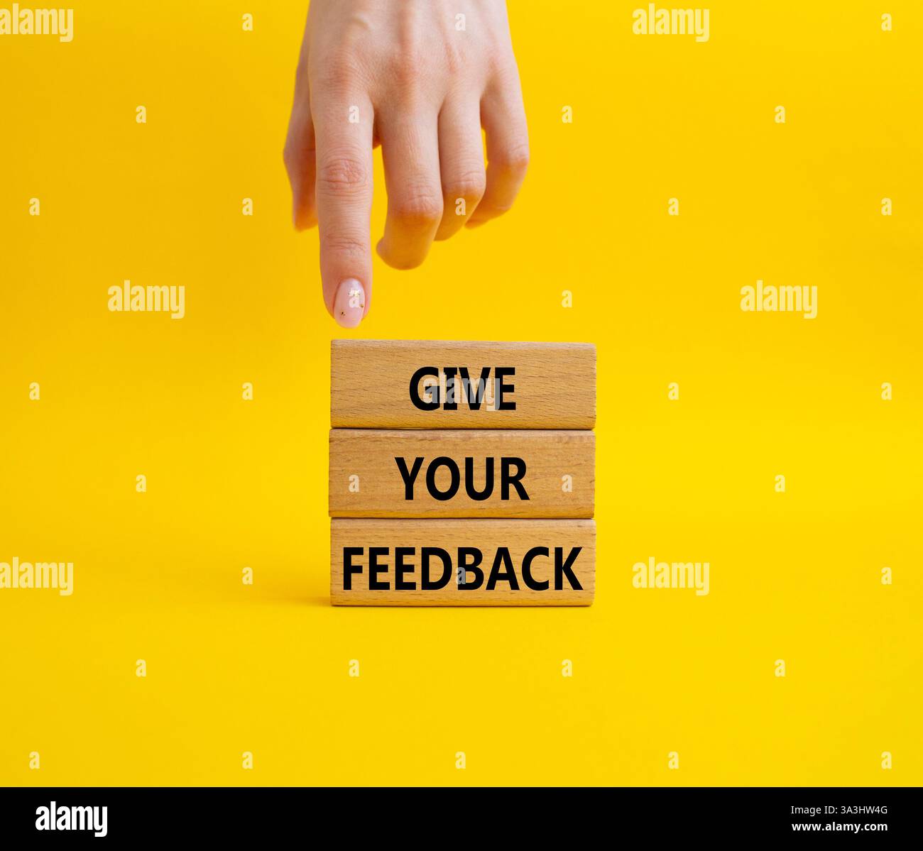 Feedback symbol. Concept word Give your feedback on wooden blocks ...
