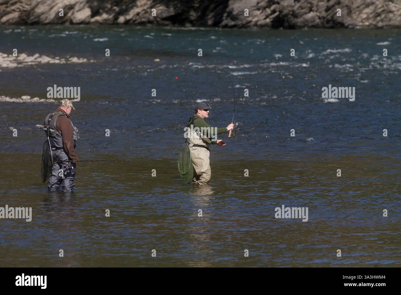 Two men fish in the river Sil, on March 16, 2025, in Quiroga, Lugo ...