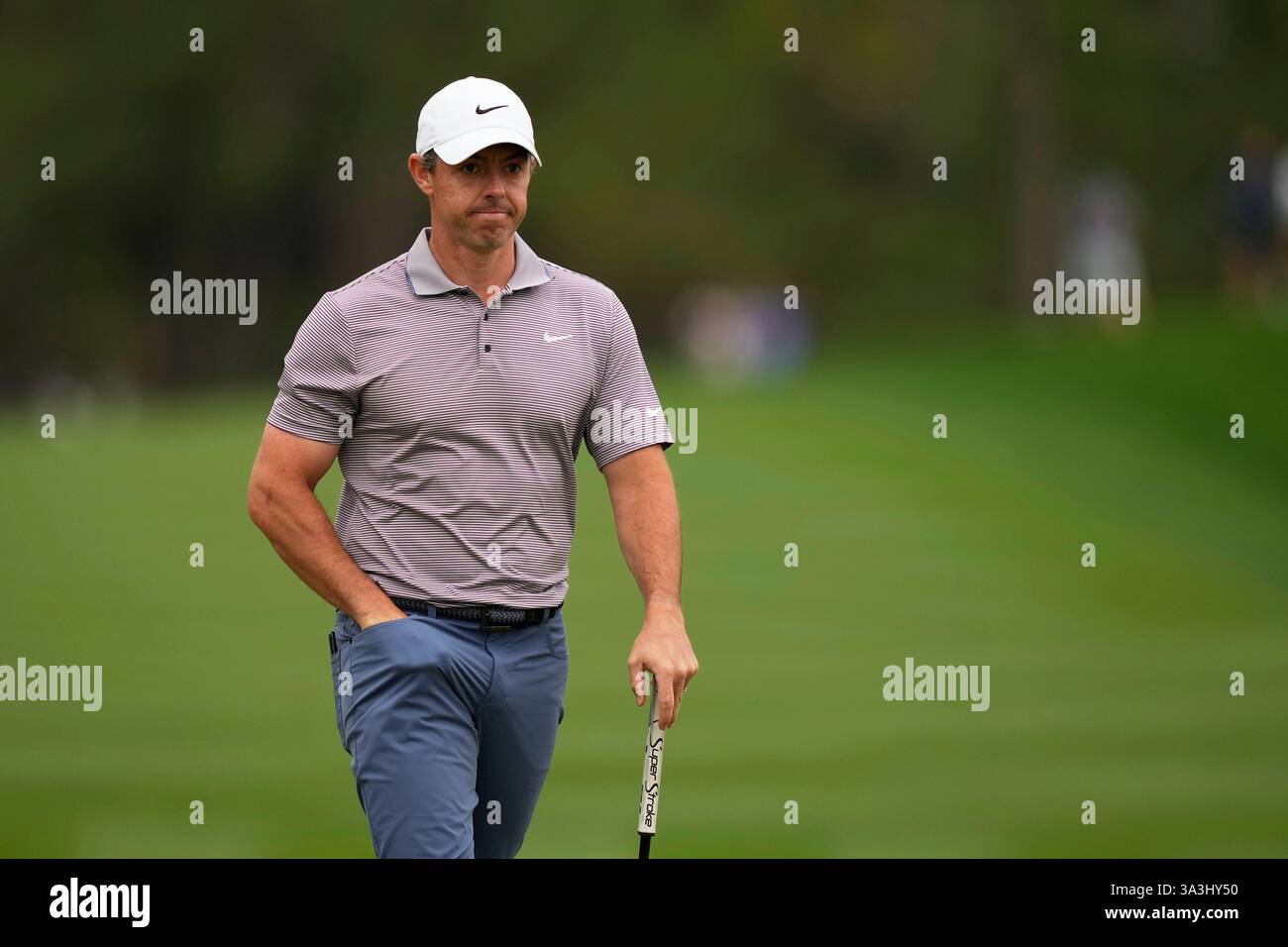 Rory McIlroy, of Northern Ireland, reacts after a shot on the second ...