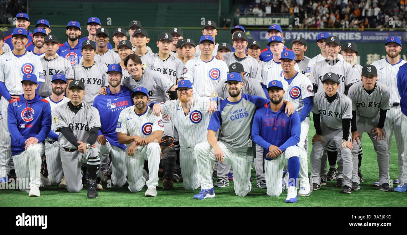 Players of Chicago Cubs and Yomiuri Giants pose for photo after the ...