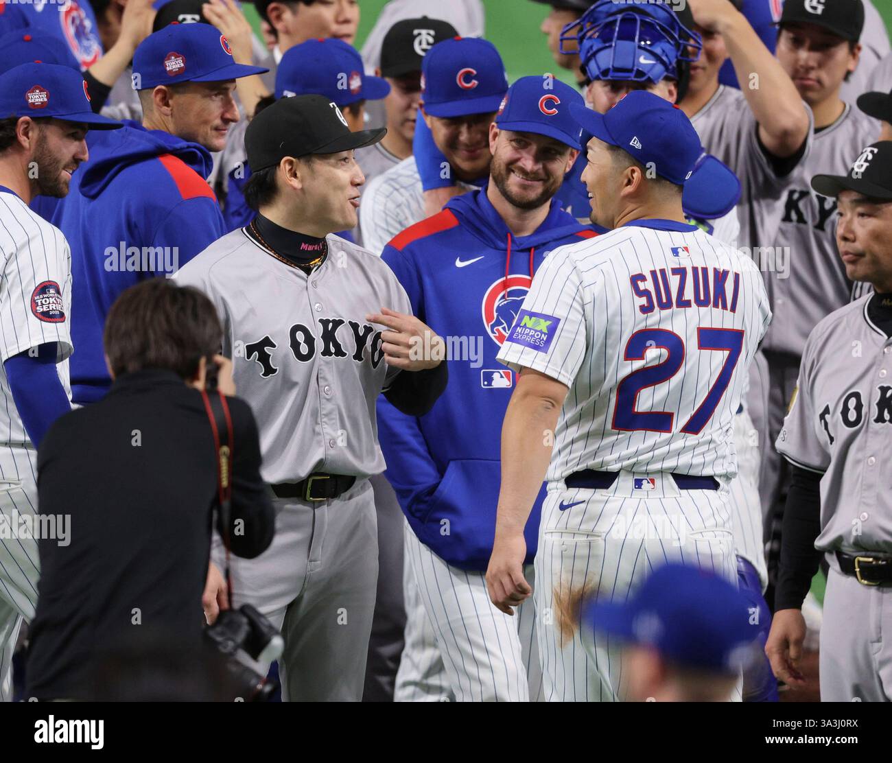 Chicago Cubs' Seiya Suzuki (R) and Yomiuri Giants' Yoshihiro Maru (L ...