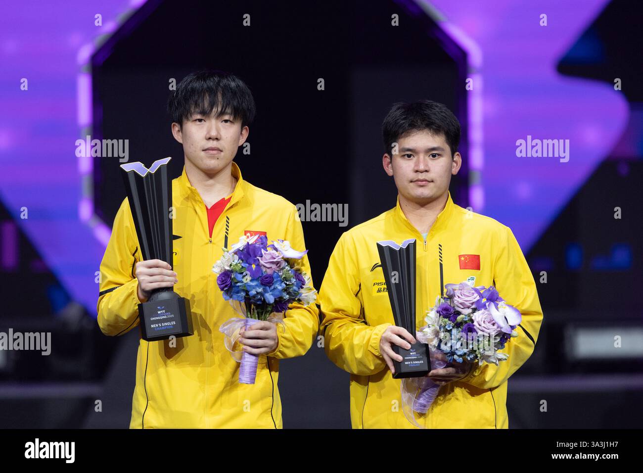 Chongqing, China. 16th Mar, 2025. Wang Chuqin (L) and Lin Shidong of China pose for photos ...