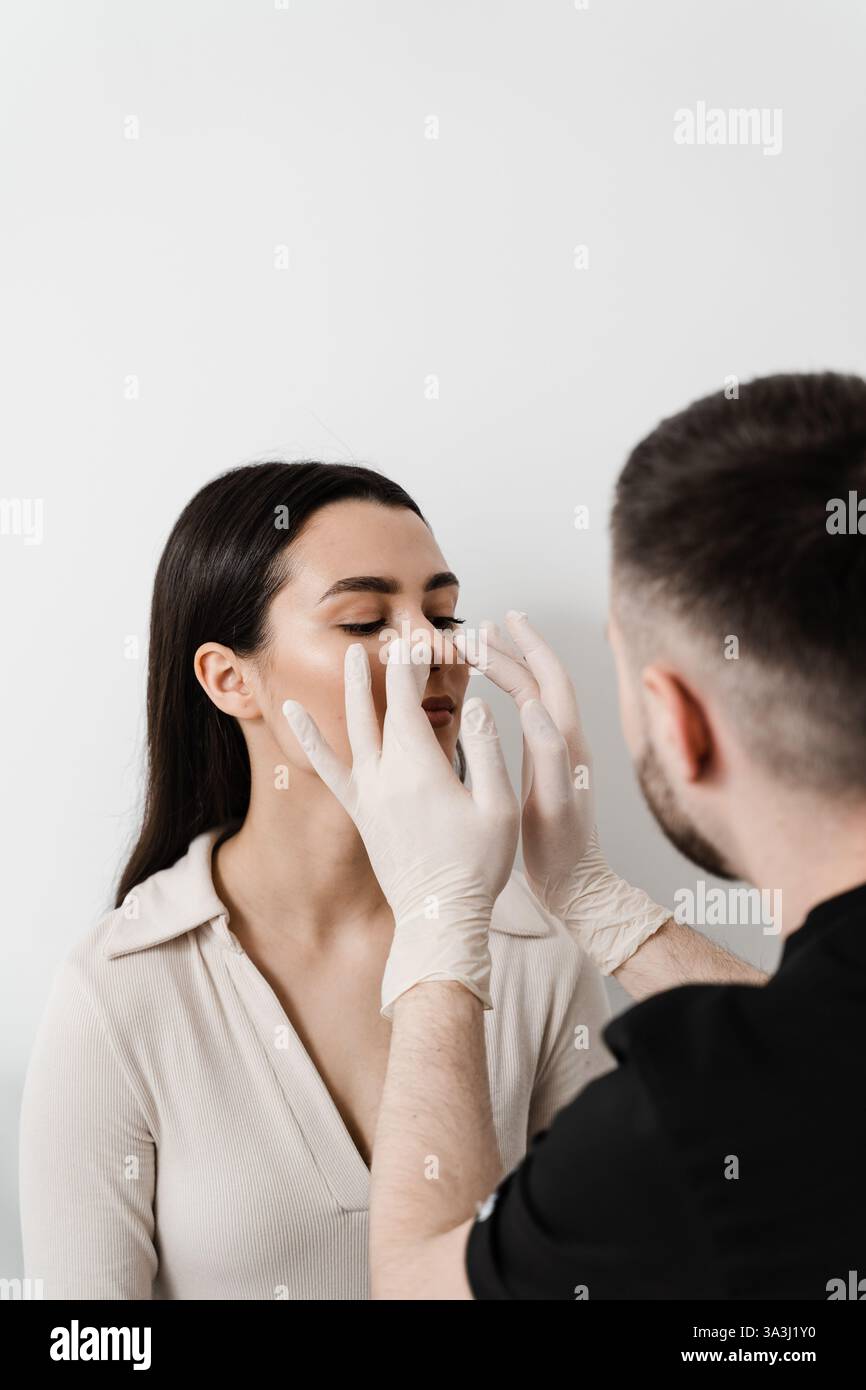 ENT doctor examines and palpates the nasal septum for septoplasty ...