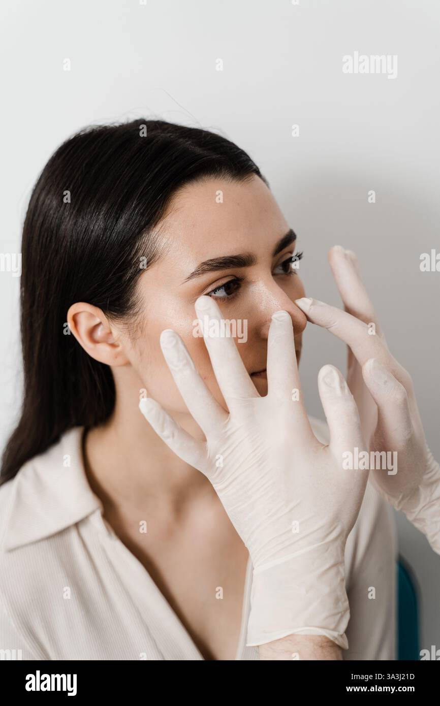 ENT doctor examines and palpates the nasal septum for septoplasty ...