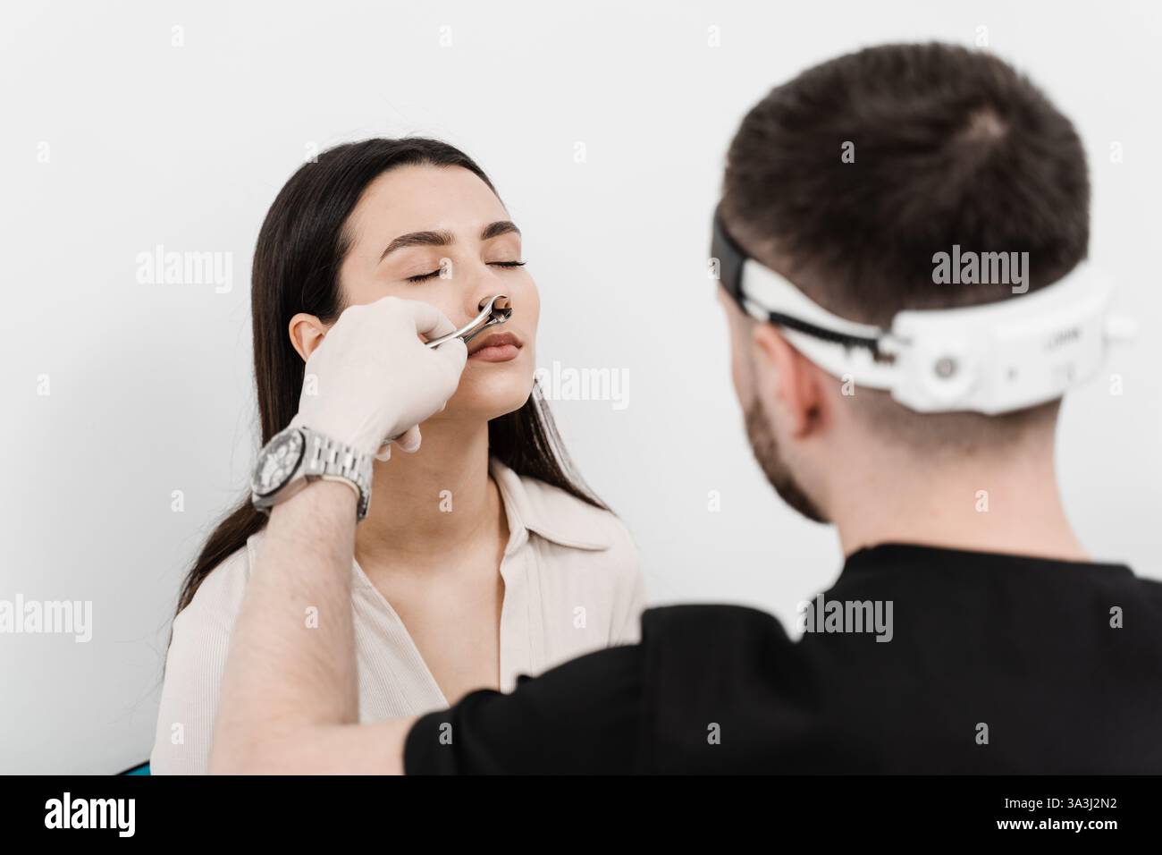 Rhinoscopy of woman nose. Consultation with ENT doctor ...
