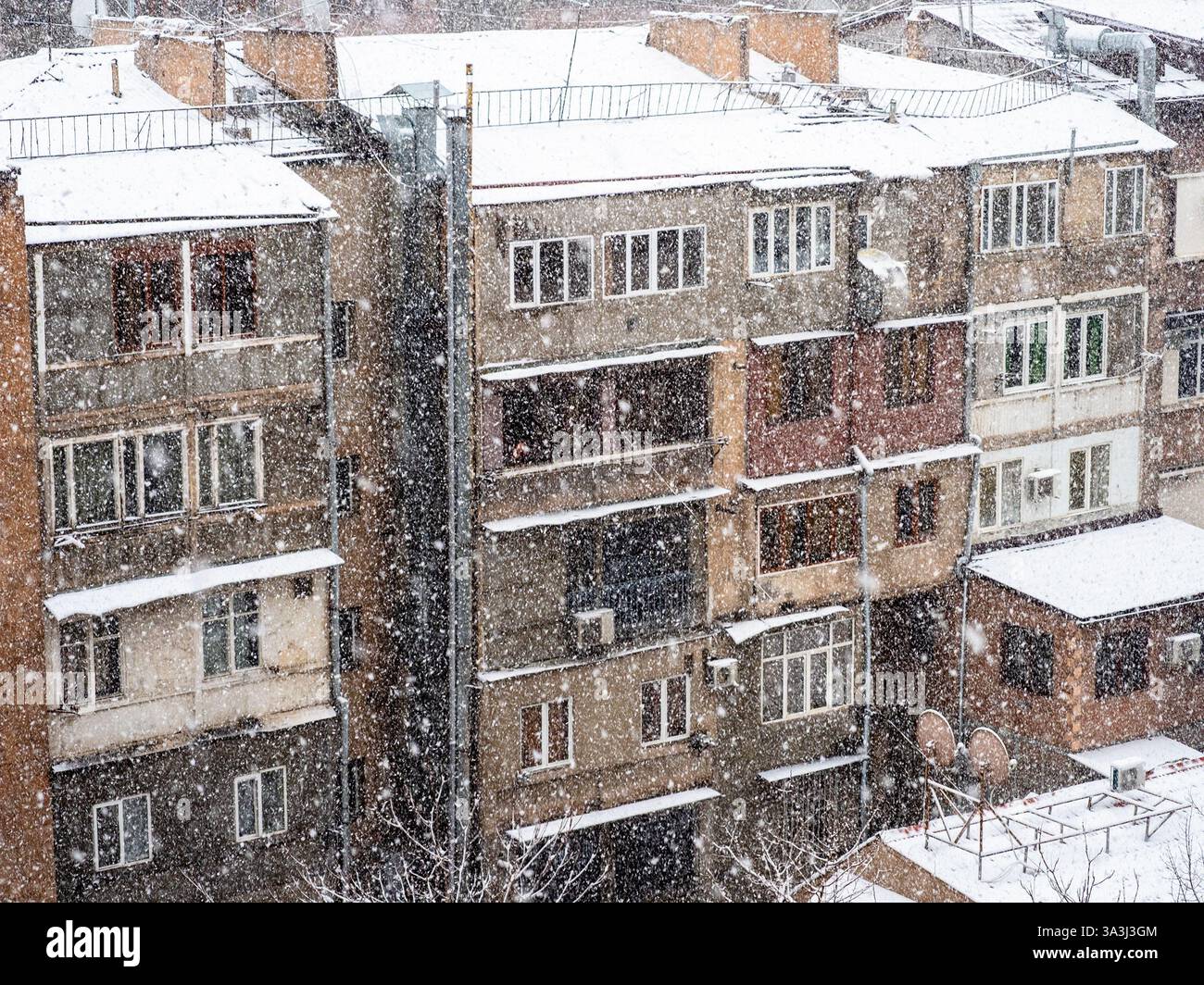 Snowfall facades apartment buildings hi-res stock photography and ...