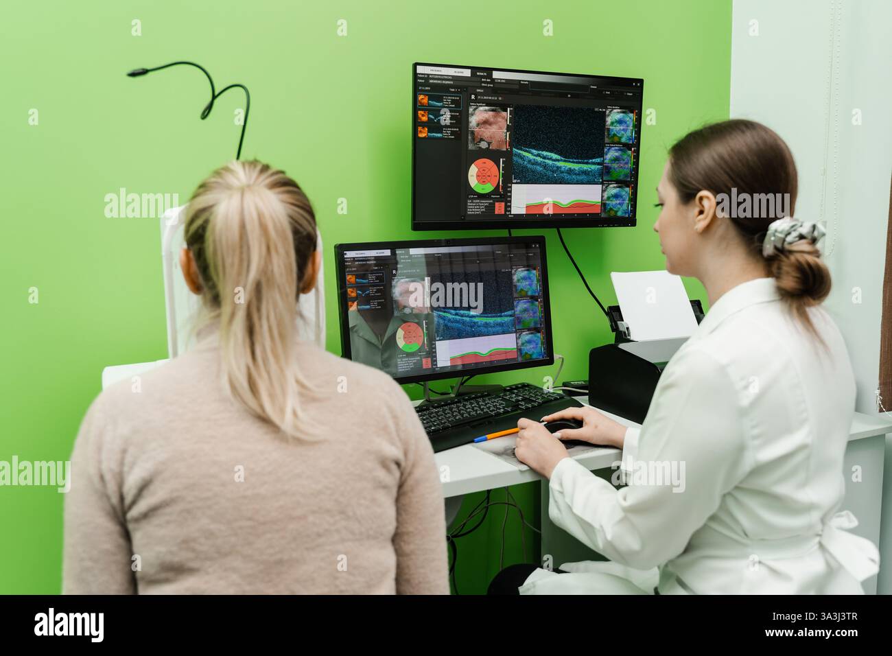 Examination of eyes of patient using optical coherence tomograph ...