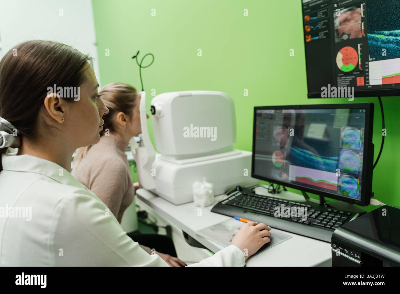 Examination of eyes of patient using optical coherence tomograph ...