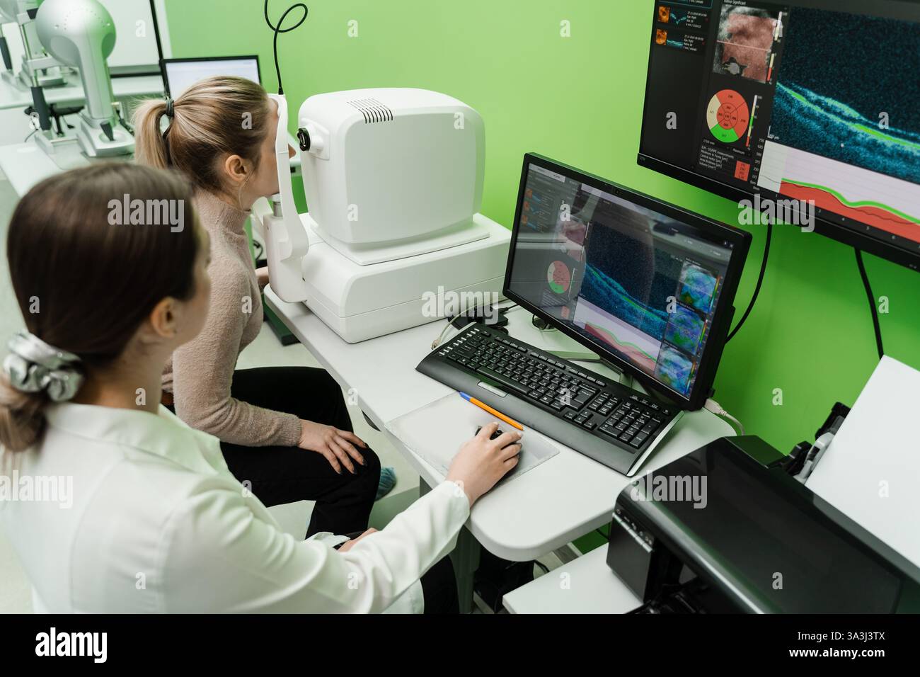 Examination of eyes of patient using optical coherence tomograph ...