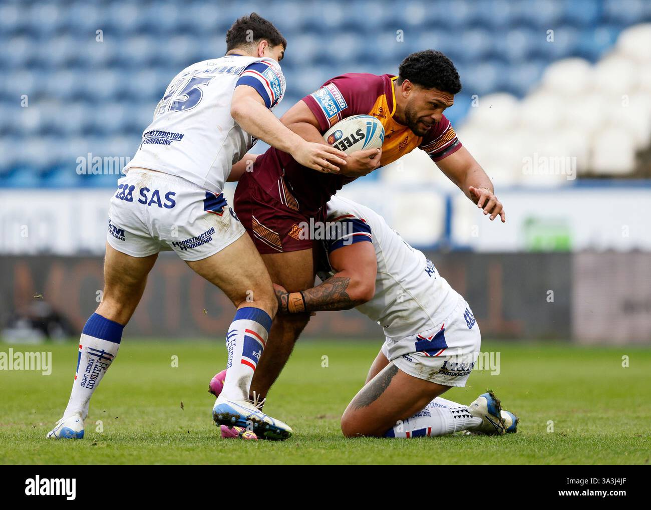 Huddersfield Giants' Taane Milne is tackled during the Betfred ...