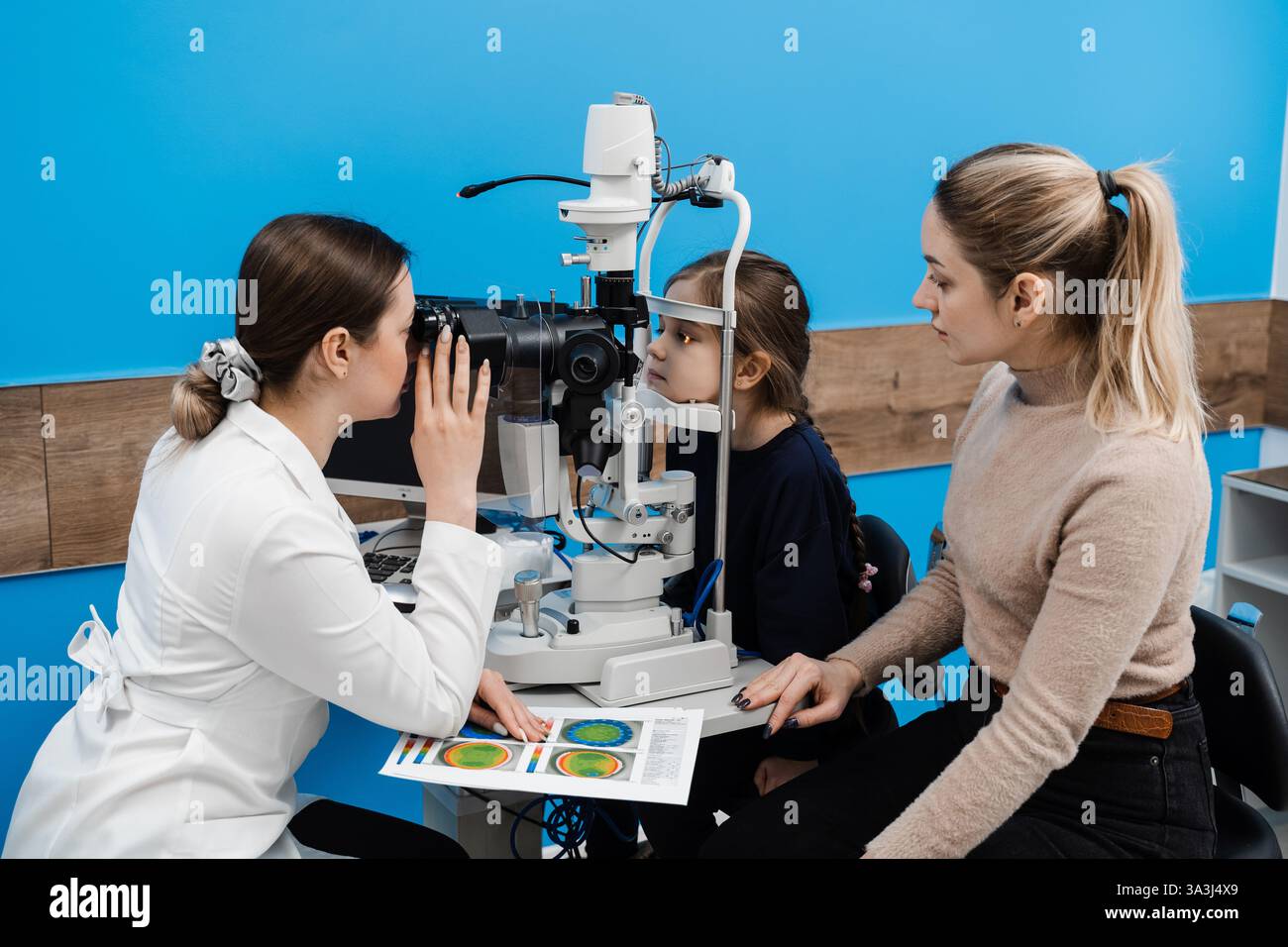 Slit lamp diagnosis and examination of the cornea and eyes of child ...