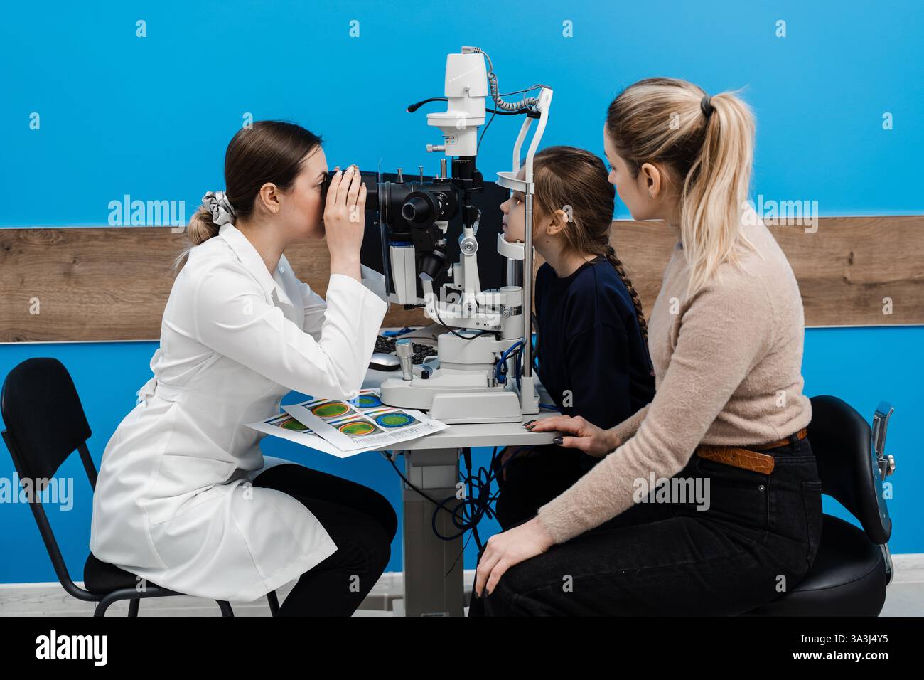 Slit lamp diagnosis and examination of the cornea and eyes of child ...