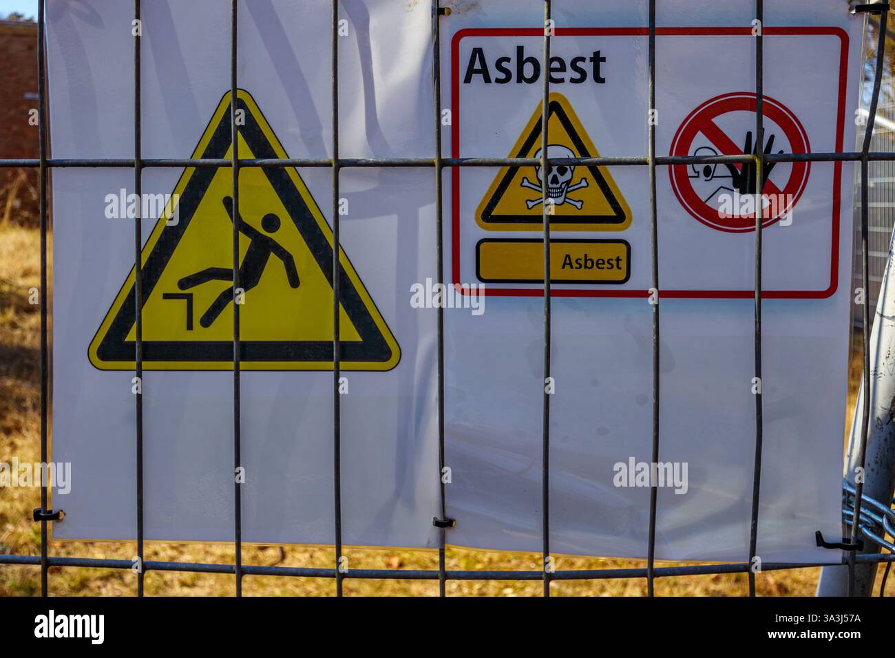 Asbestos hazard warning signs, tripping hazard, and no entry, damaged ...