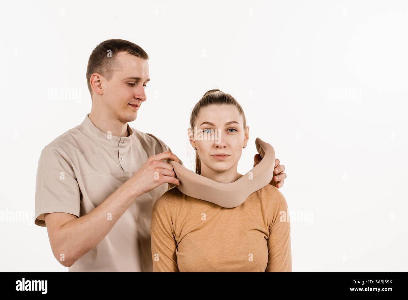 Neurosurgeon puts neck bandage on girl to stabilize the cervical region ...
