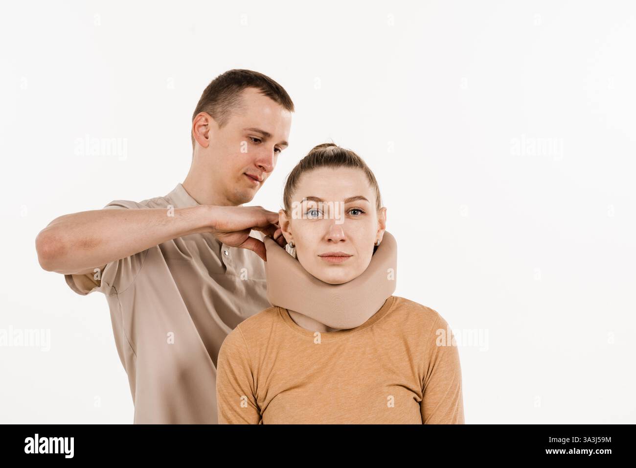 Neurosurgeon puts neck bandage on girl to stabilize the cervical region ...